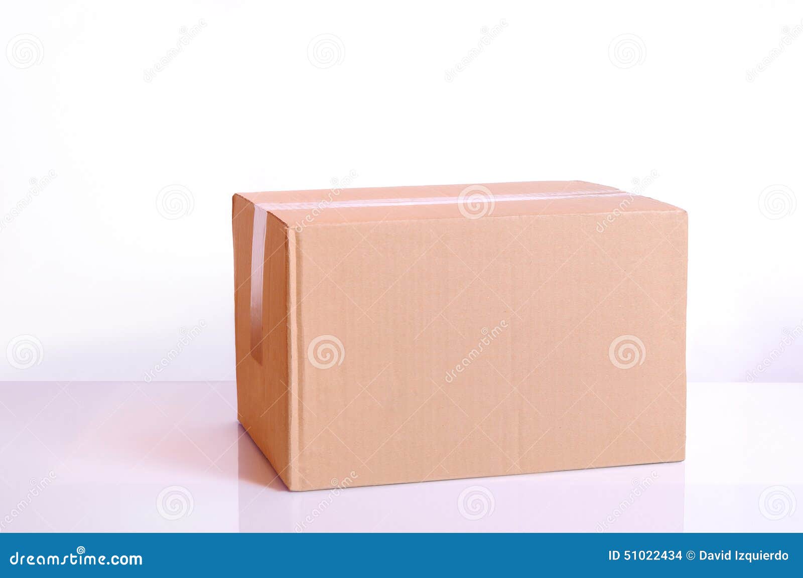 Cardboard box on a table stock photo. Image of carton - 51022434