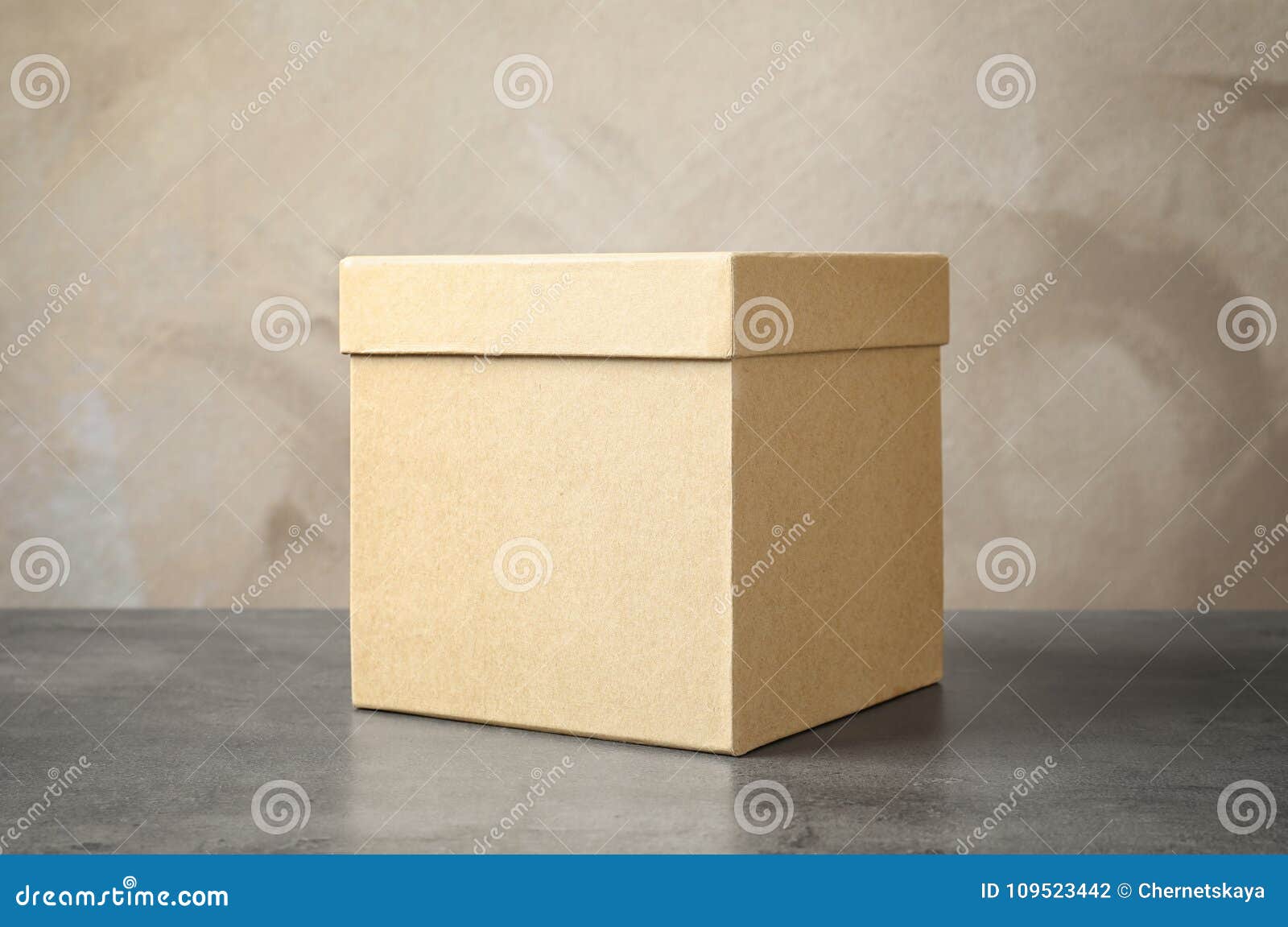 Cardboard box on table stock photo. Image of design - 109523442