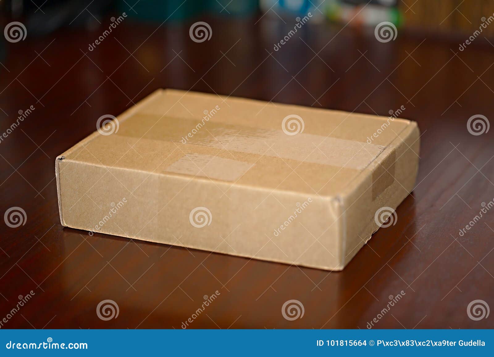 Cardboard Box on a Table stock photo. Image of container - 101815664
