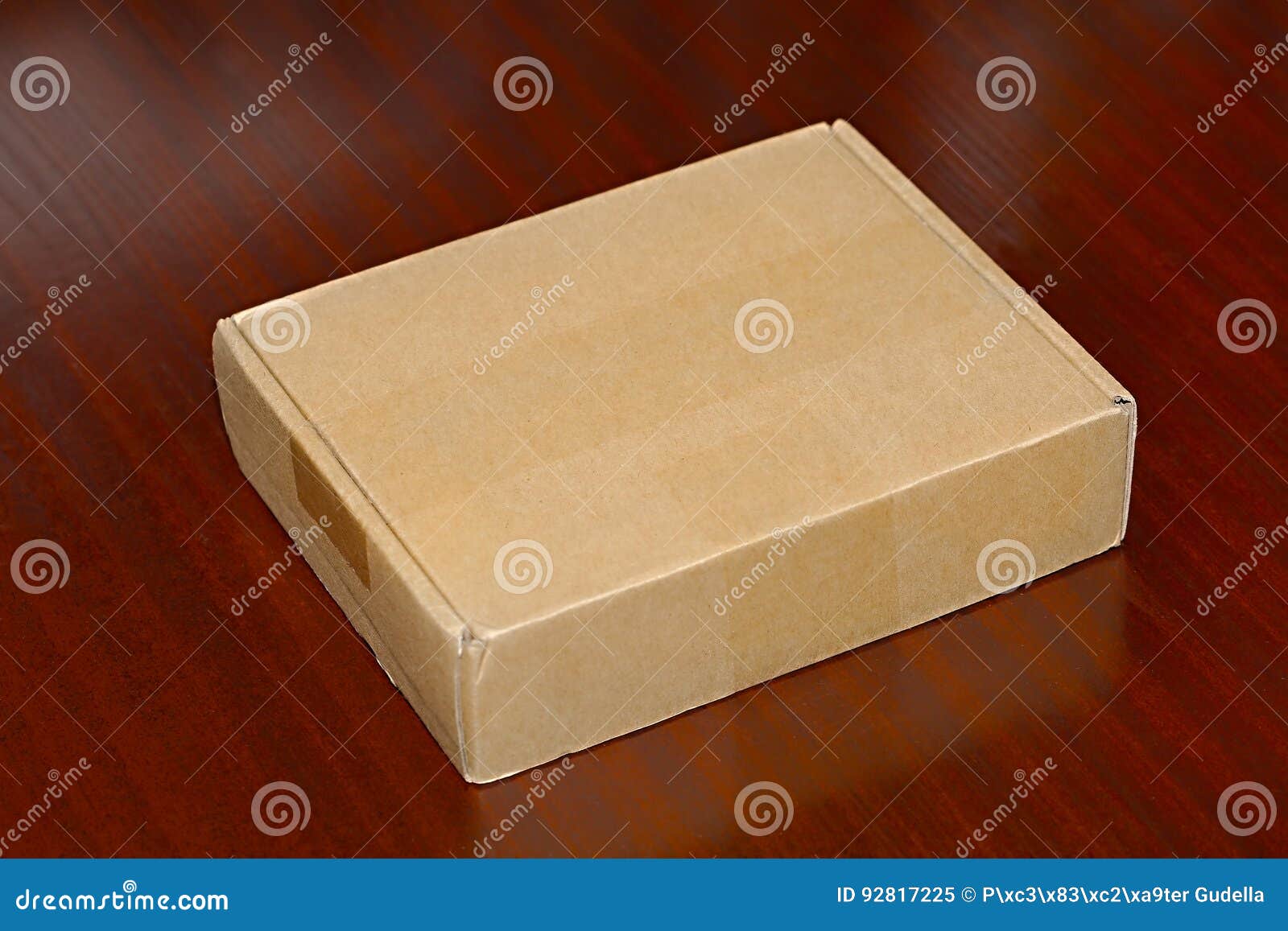 Cardboard Box on a Table stock image. Image of parcell - 92817225