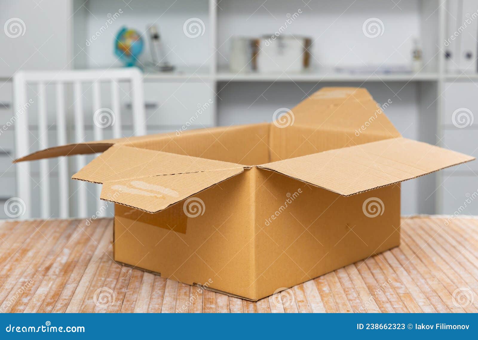 Cardboard box on table stock image. Image of shipping - 238662323