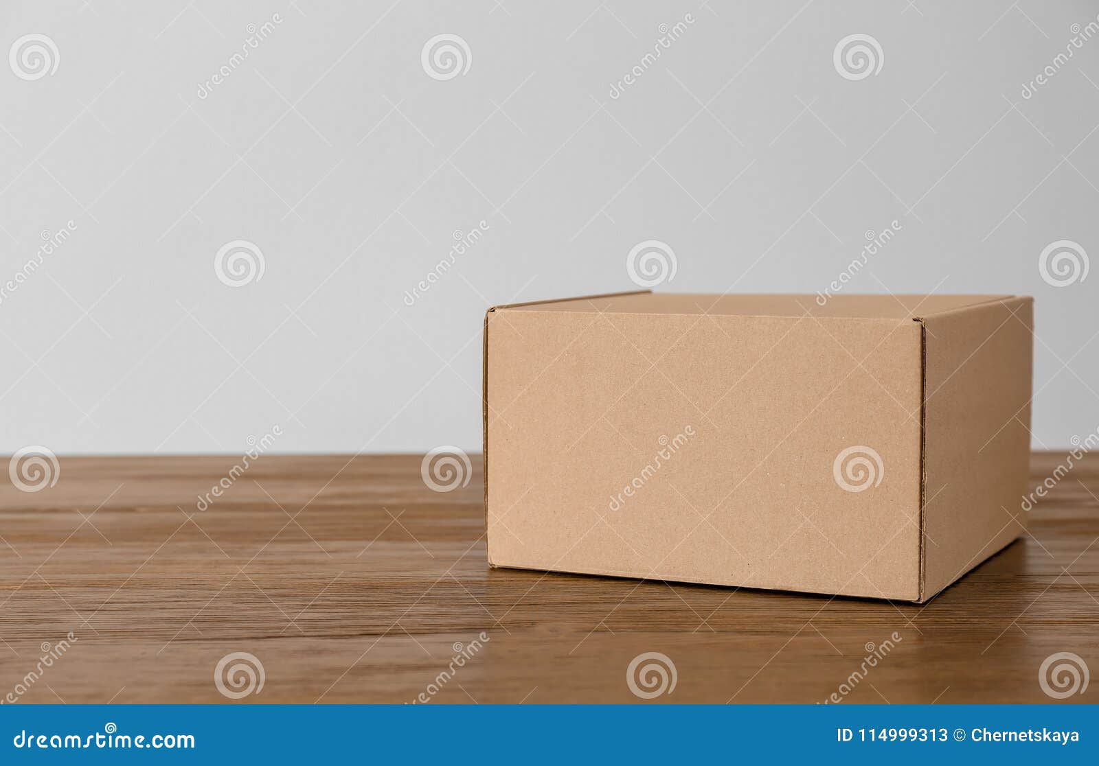 Cardboard box on table stock image. Image of transfer - 114999313