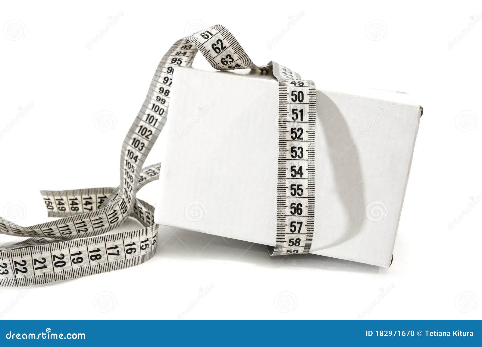Cardboard Box with Tape Measure on a White Background. Stock Photo ...