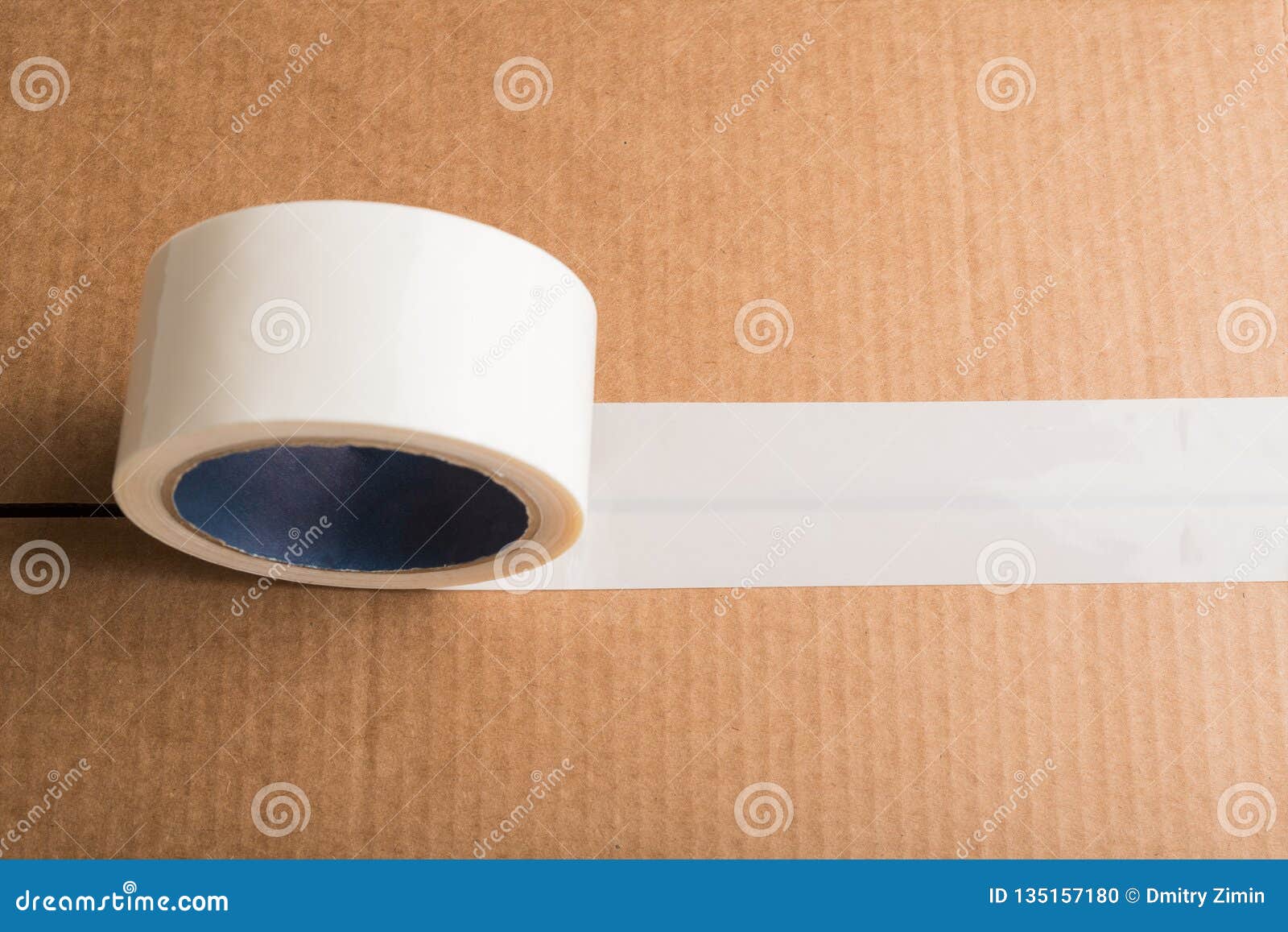 Cardboard Box with White Adhesive Tape with Copyspace Stock Photo ...