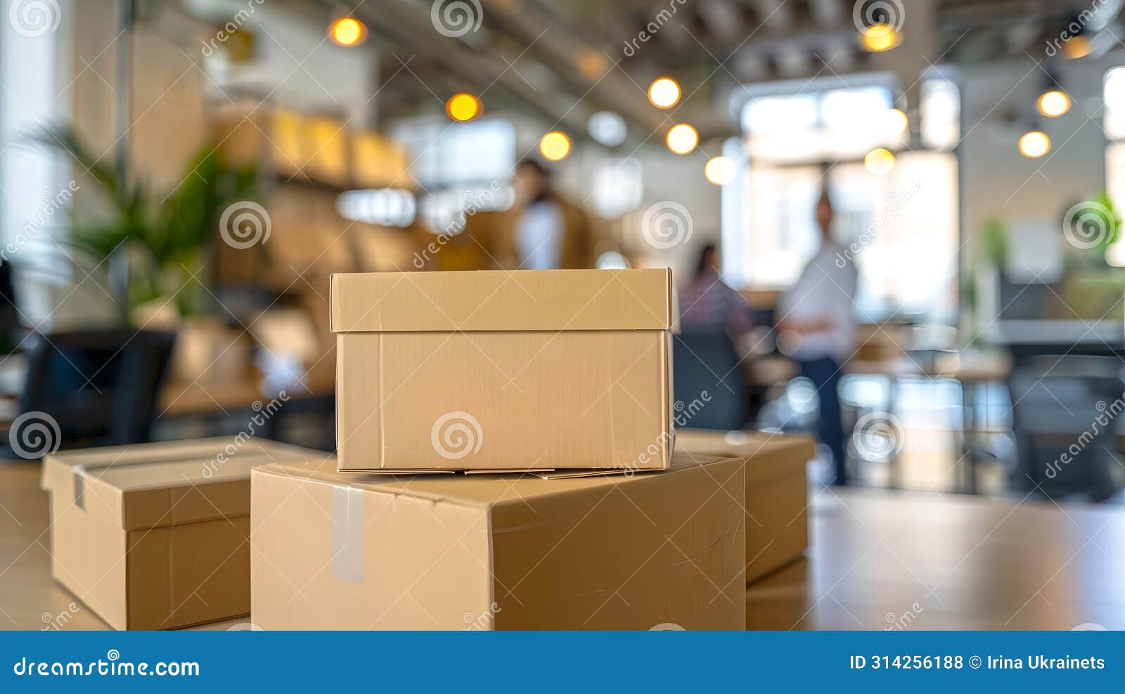 Stack of Plain Cardboard Boxes on a Table in a Bright, Modern Office ...