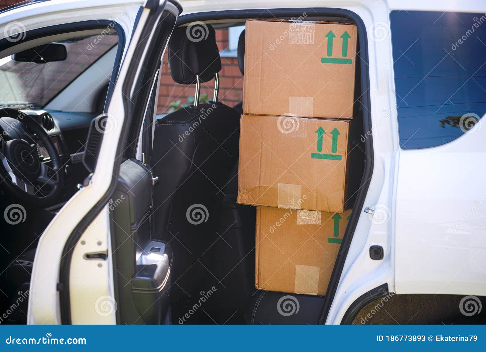 Cardboard Boxes on Back Seat of a Car Stock Image - Image of door ...