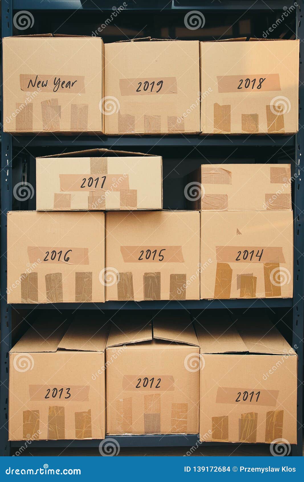 Cardboard Boxes Labeled Number of Years on Shelves Stock Photo - Image ...