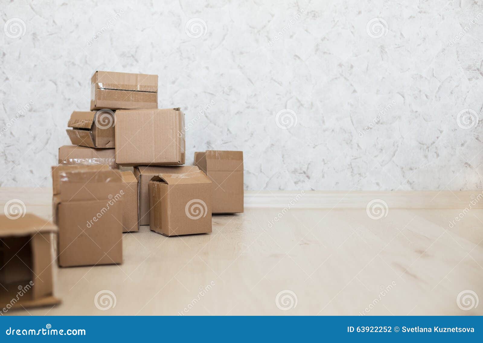 Cardboard Boxes on Laminate Floor Stock Photo - Image of cardboard ...