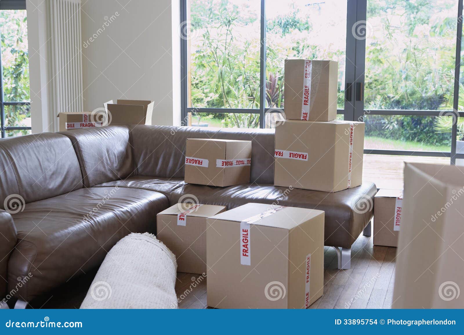 Cardboard Boxes in New Living Room Stock Photo - Image of floor ...