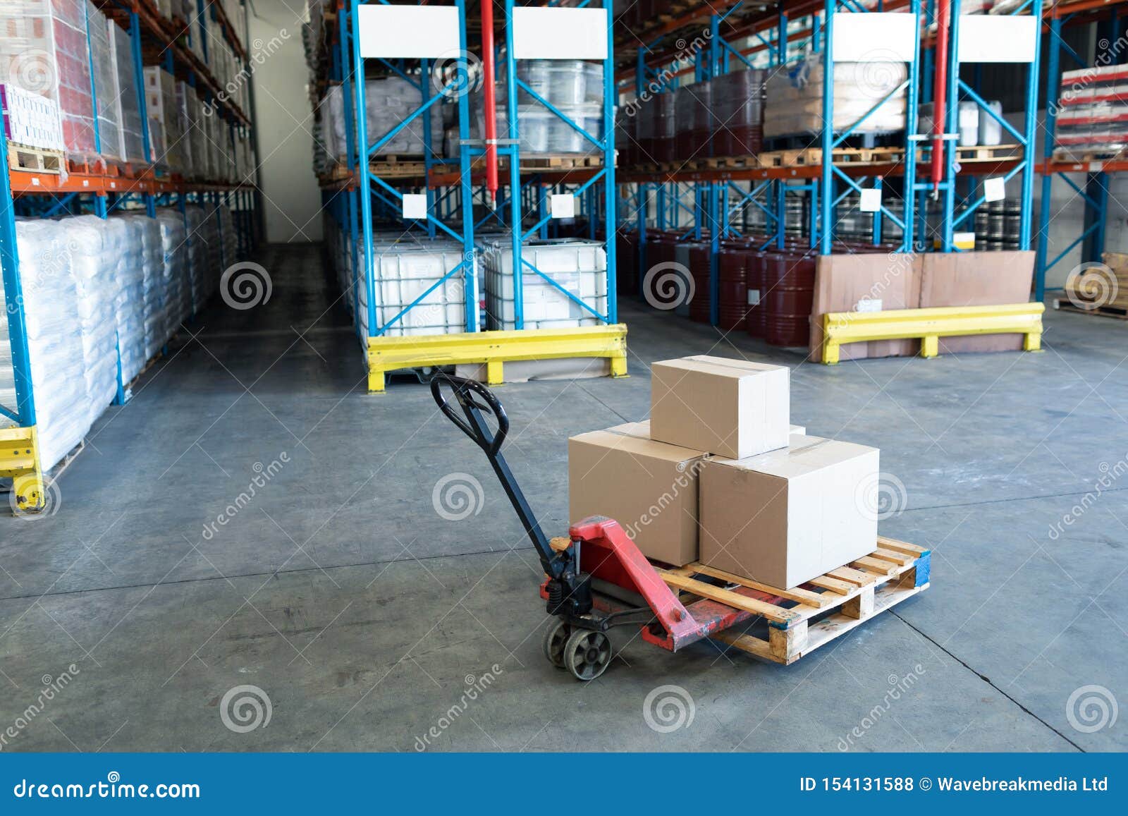 Cardboard Boxes on a Pallet Jack in Warehouse Stock Photo - Image of ...
