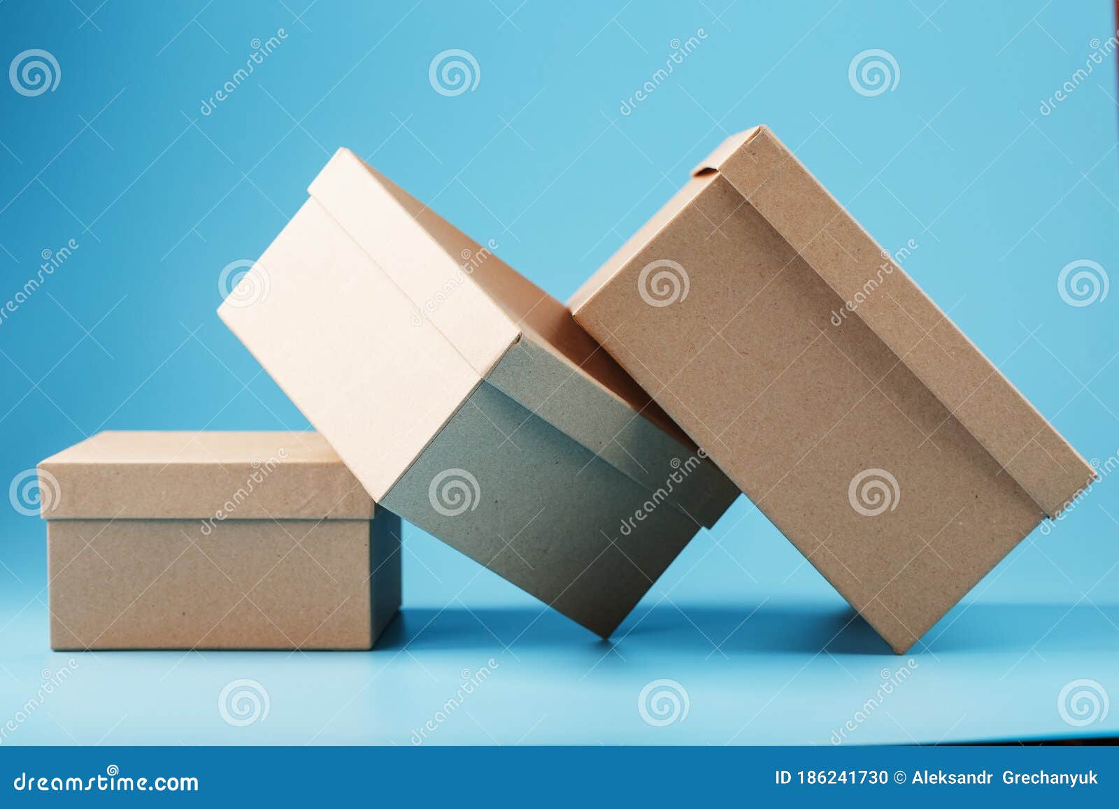 Cardboard Boxes Spread Out on a Blue Background, Free Space Stock Photo ...