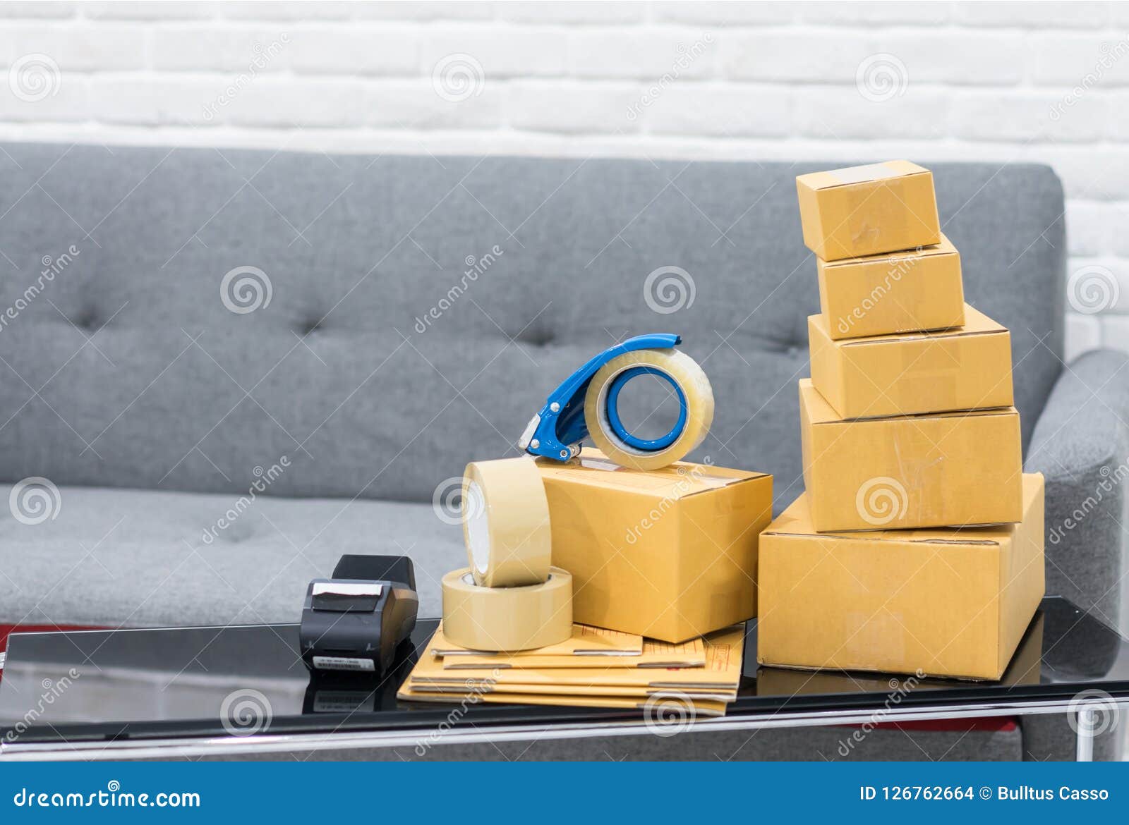 Cardboard Boxes Stacked and Tools on Table with Copy Space. Stock Photo ...