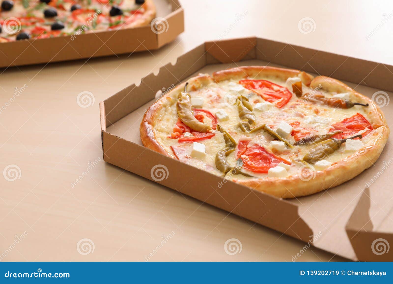 Cardboard Boxes with Tasty Pizzas on Table Stock Image - Image of meal ...