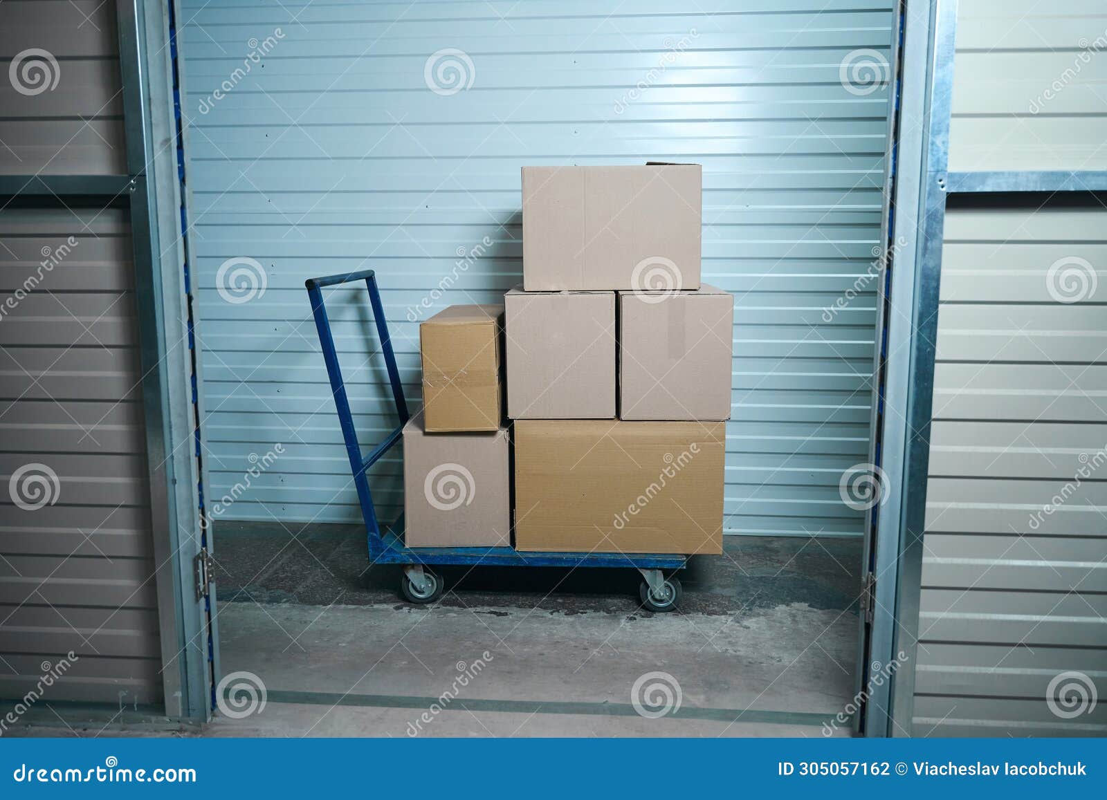 Cardboard Boxes on a Trolley in a Warehouse Stock Photo - Image of ...