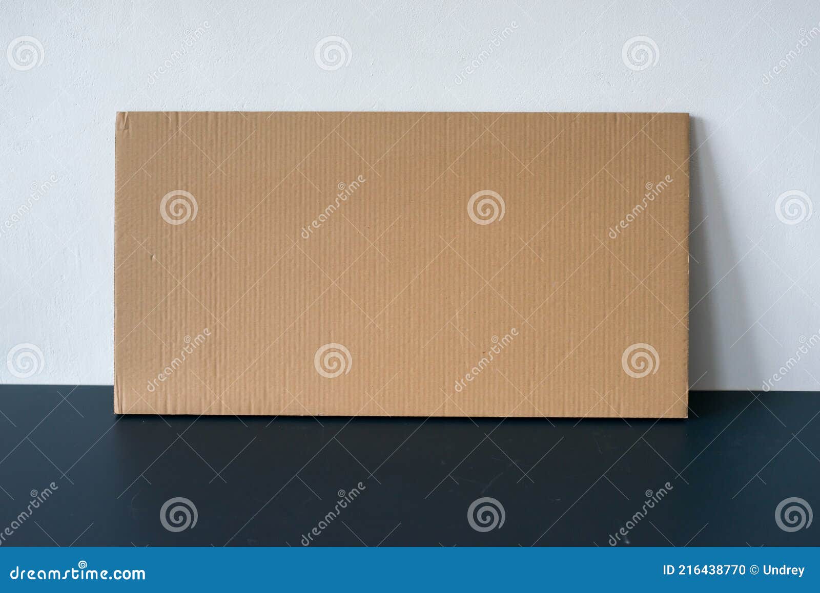 Cardboard Card on the Table by the Wall Stock Photo - Image of cover ...