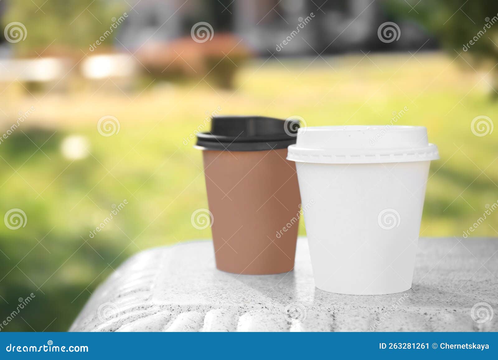 Cardboard Cups with Tasty Coffee on Stone Bench Outdoors, Closeup Stock ...