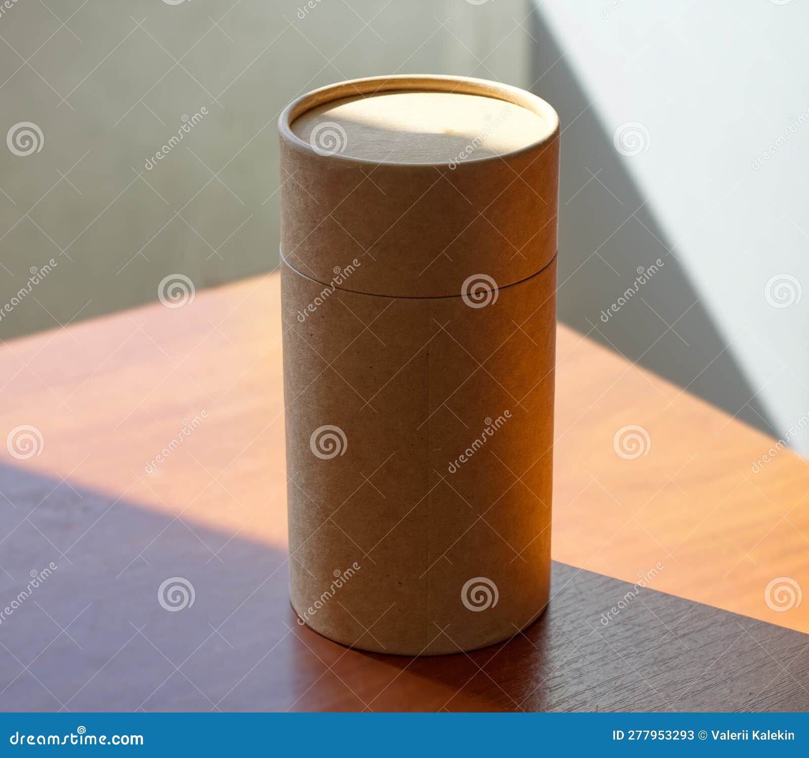 Cardboard Cylinder on the Table. Light and Shadow Stock Image - Image ...