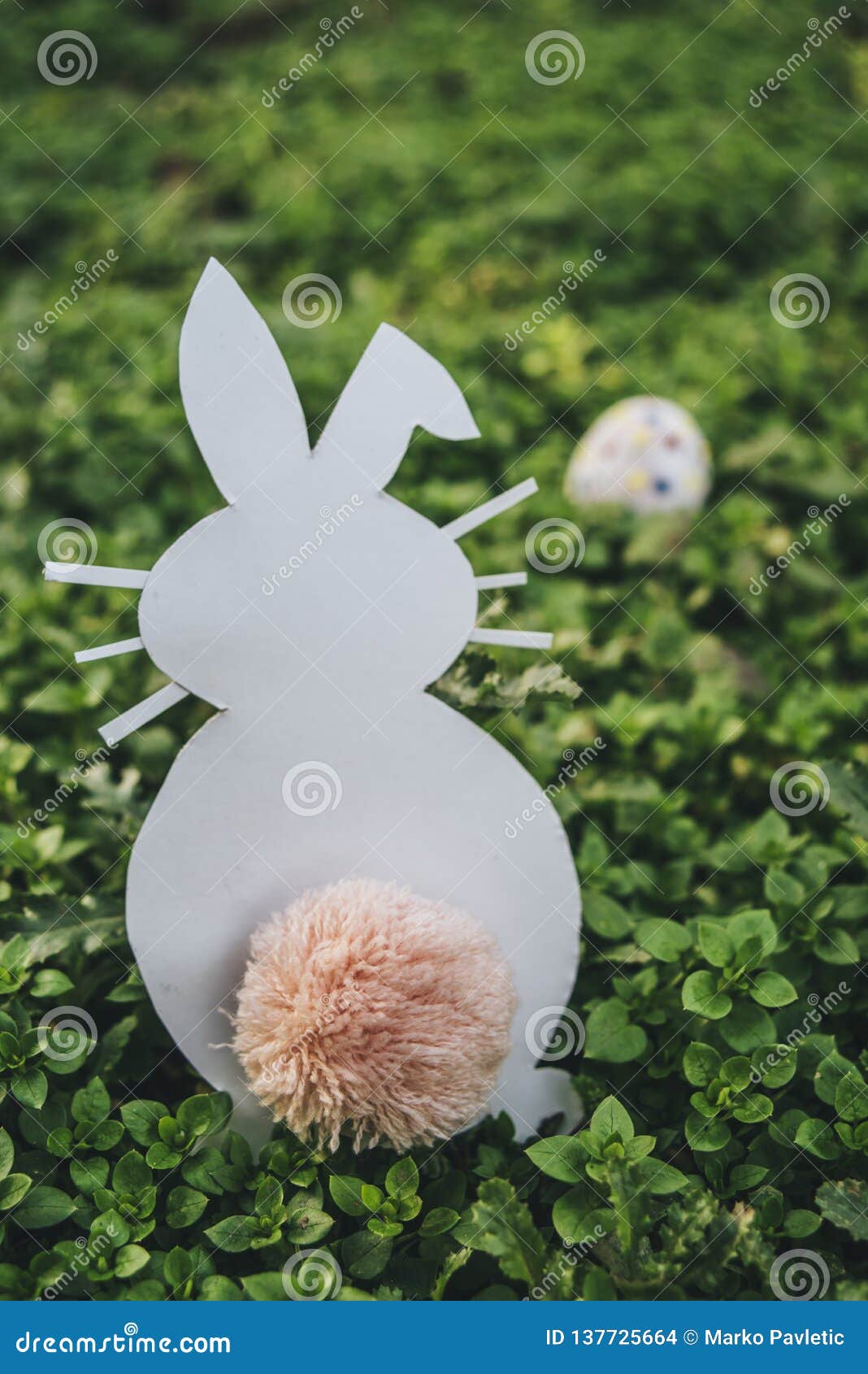 Cardboard Easter Bunny Looks at Easter Egg Stock Photo - Image of ...
