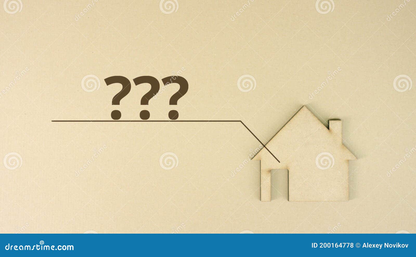 Cardboard Home Icon with Question Marks on the Table Stock Photo ...