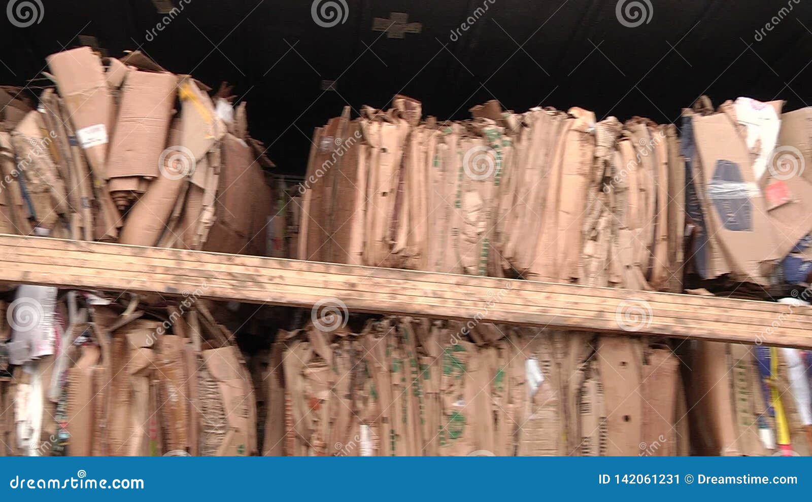 The Cardboard Packaging is Compressed and Prepared for Recycling Stock ...