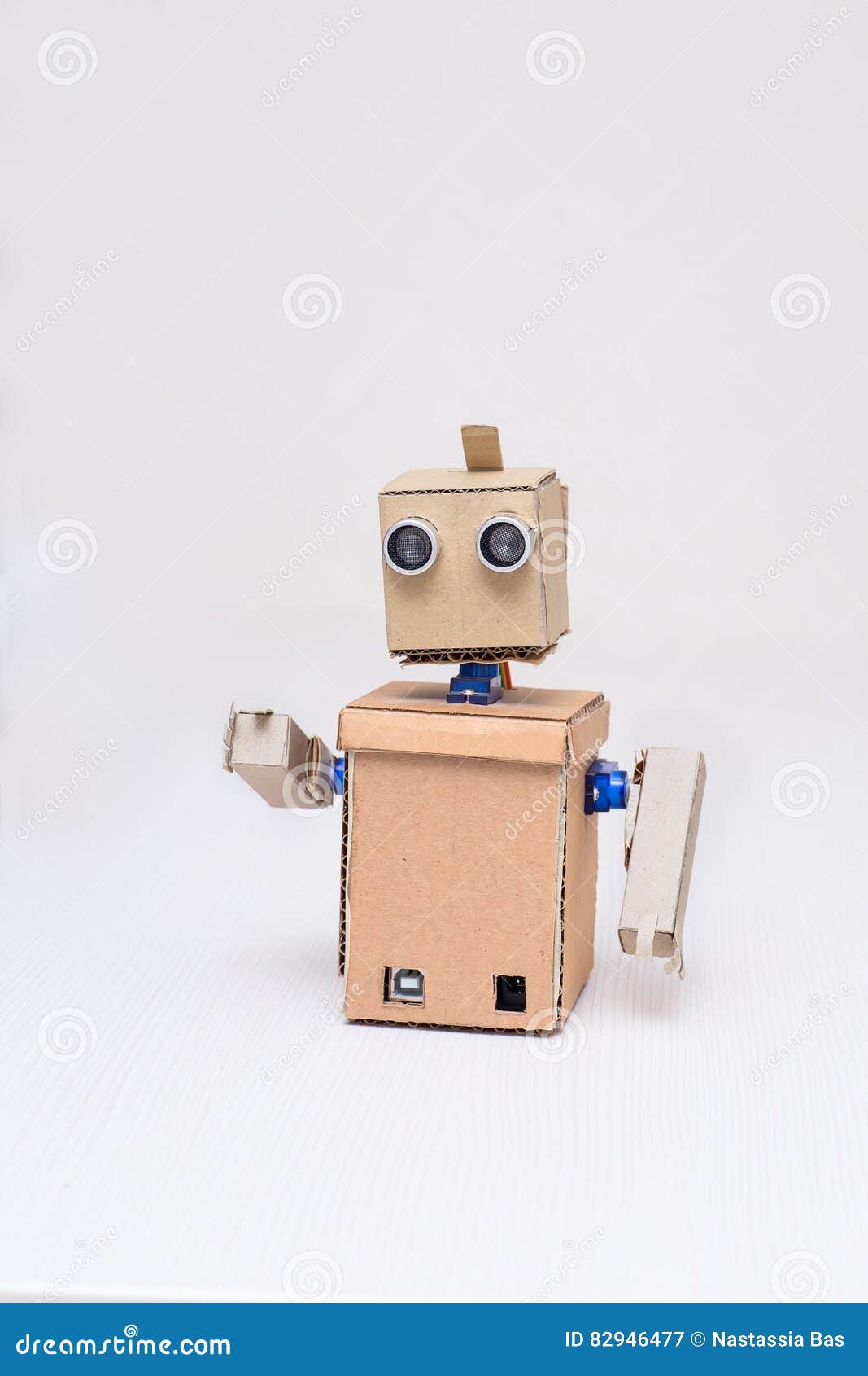 Cardboard Robot on White Background at Home Stock Image - Image of ...
