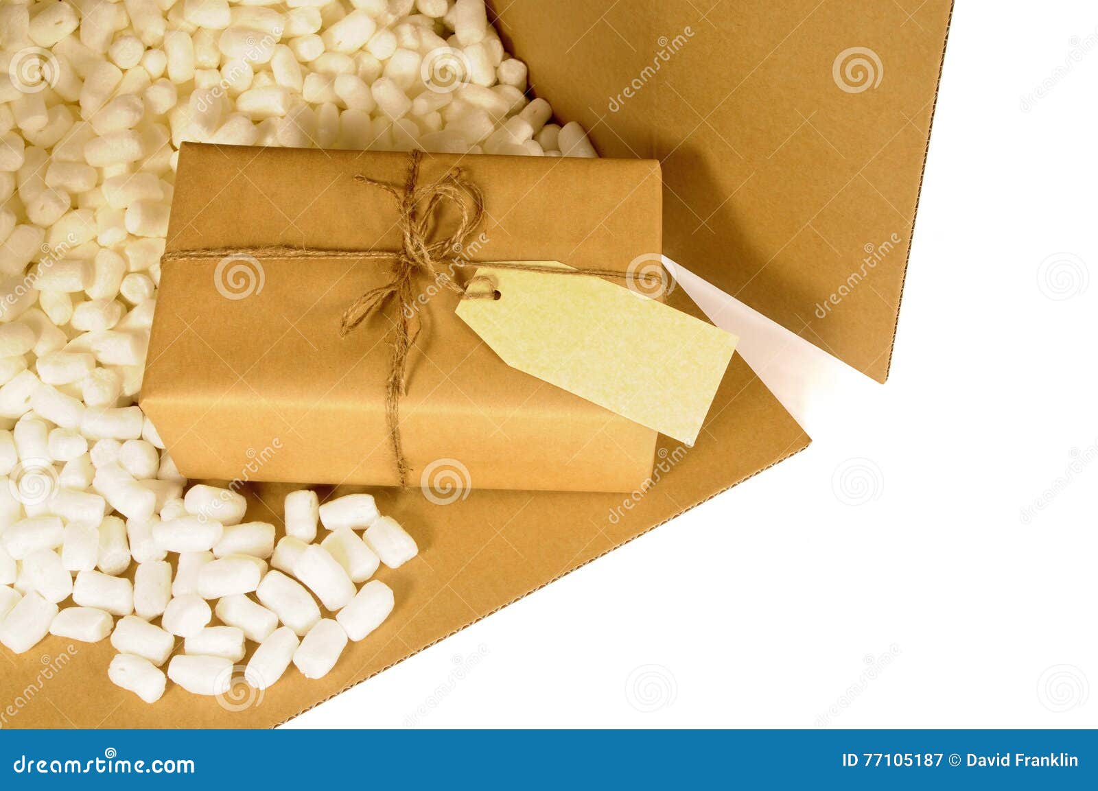 Cardboard Shipping Box with Small Wrapped Package Inside Stock Image ...