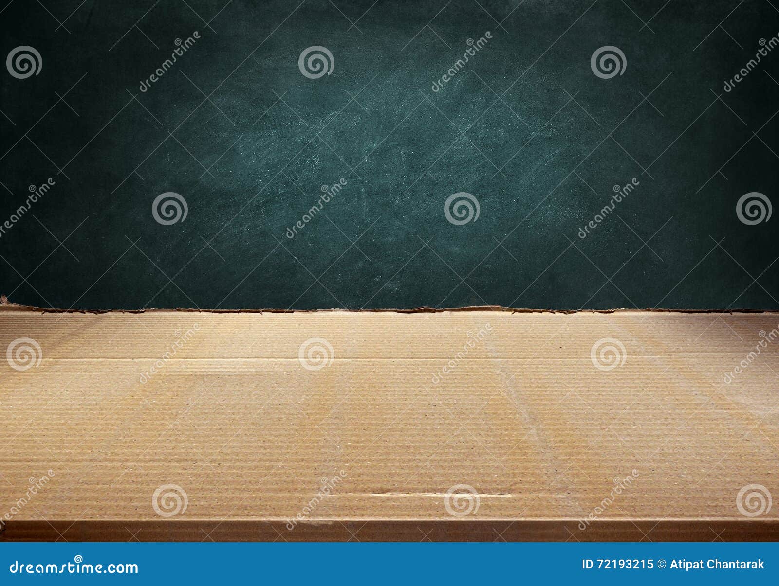 Cardboard Table with Blackboard Background Stock Image - Image of ...