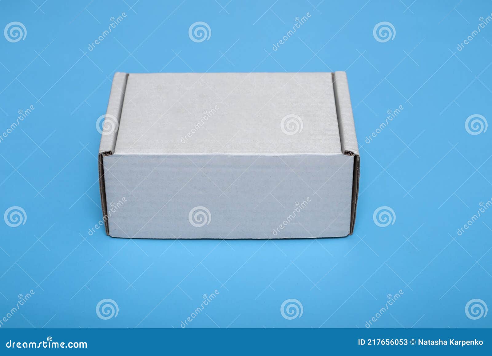 Cardboard White Box Isolated on Blue Background. Layout Stock Image ...
