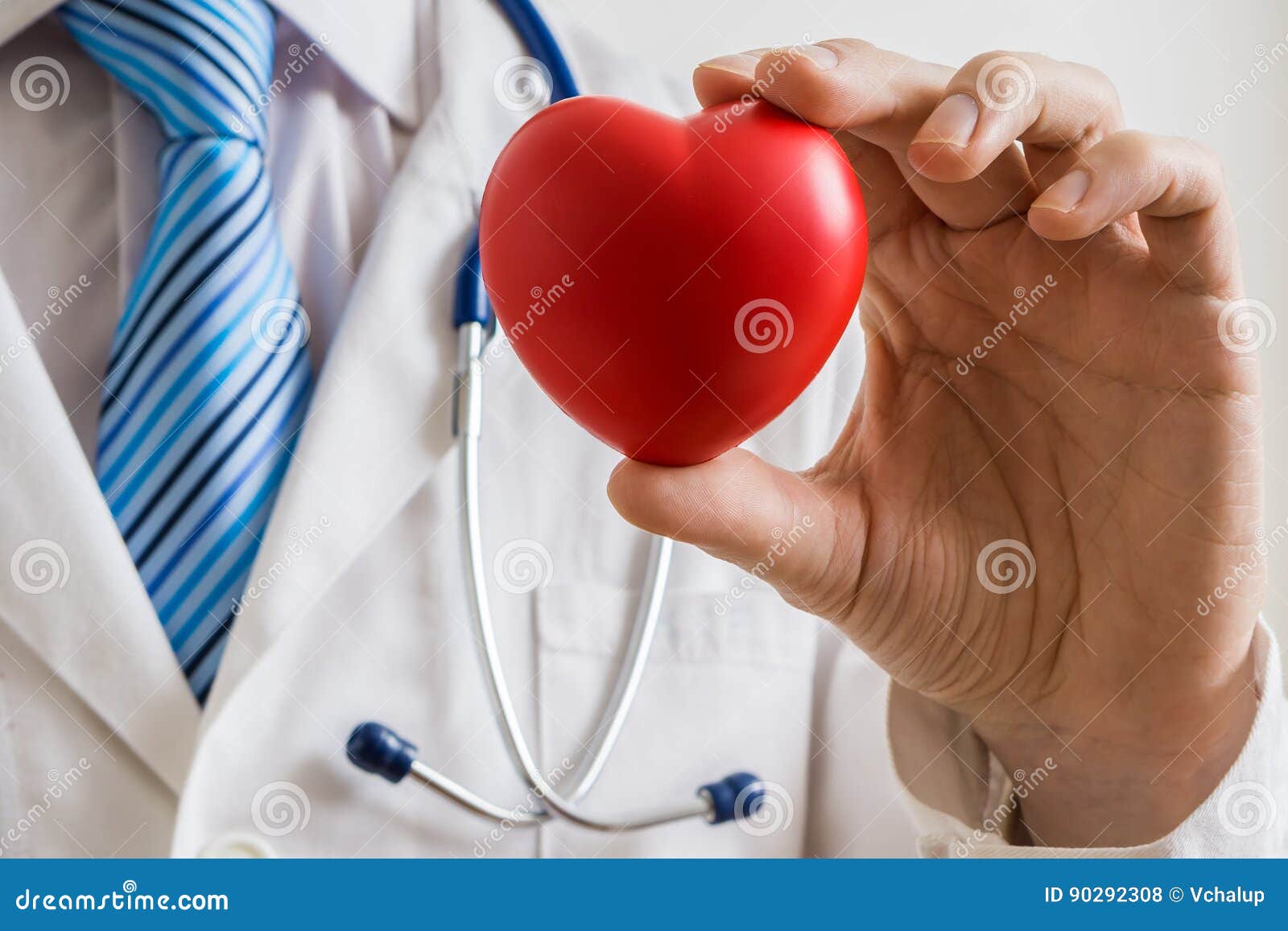 Cardiologist Doctor With Stethoscope Holding Heart Shape In Hand And ...