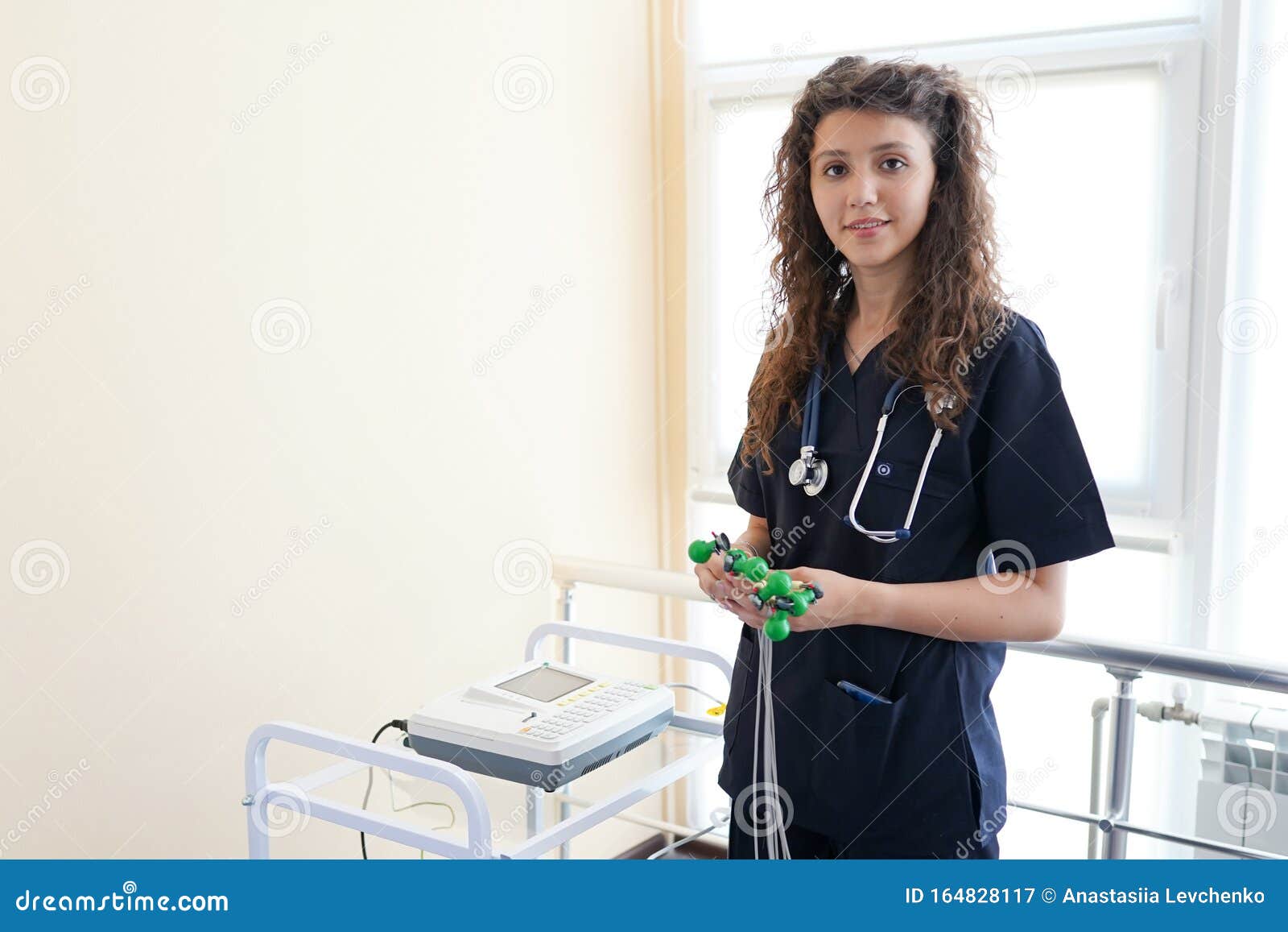 Cardiologist with Electrocardiogram Equipment in the Cabinet, Copy ...