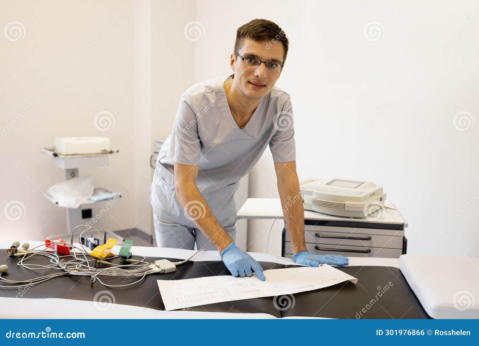 Cardiologist Reading Cardiogram Stock Photo - Image of ...