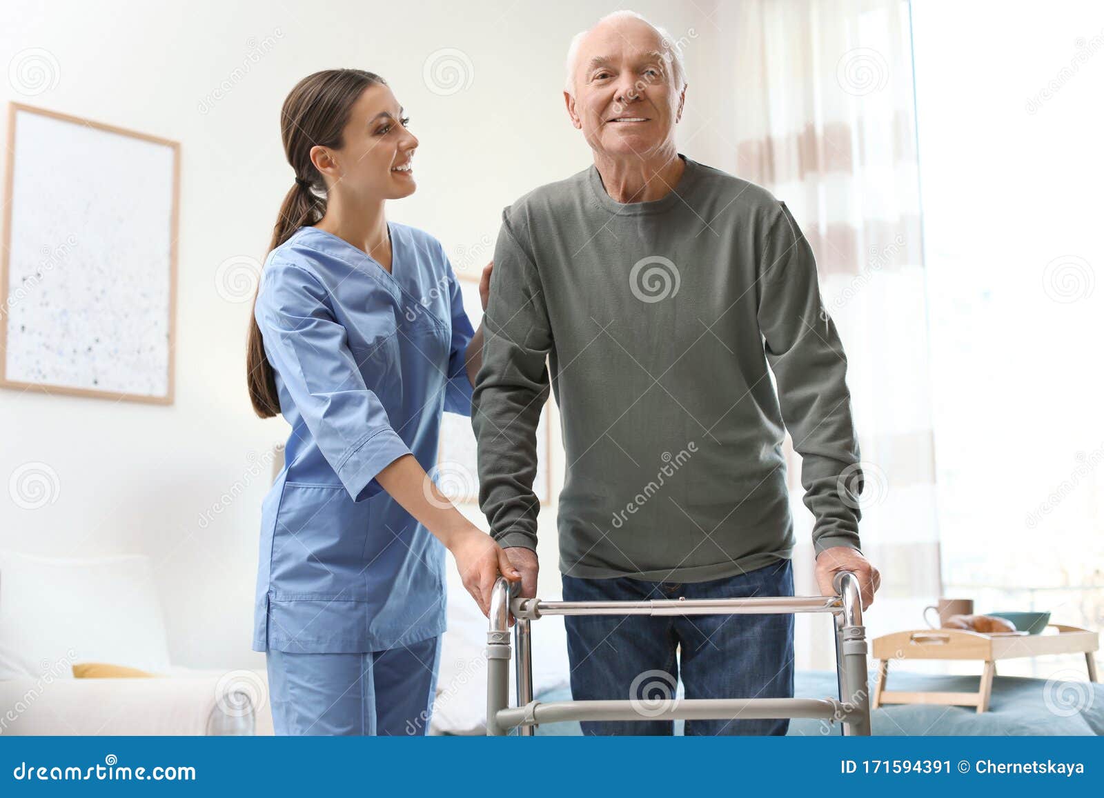 Care Worker Helping Elderly Man with Walker in Hospice Stock Image ...