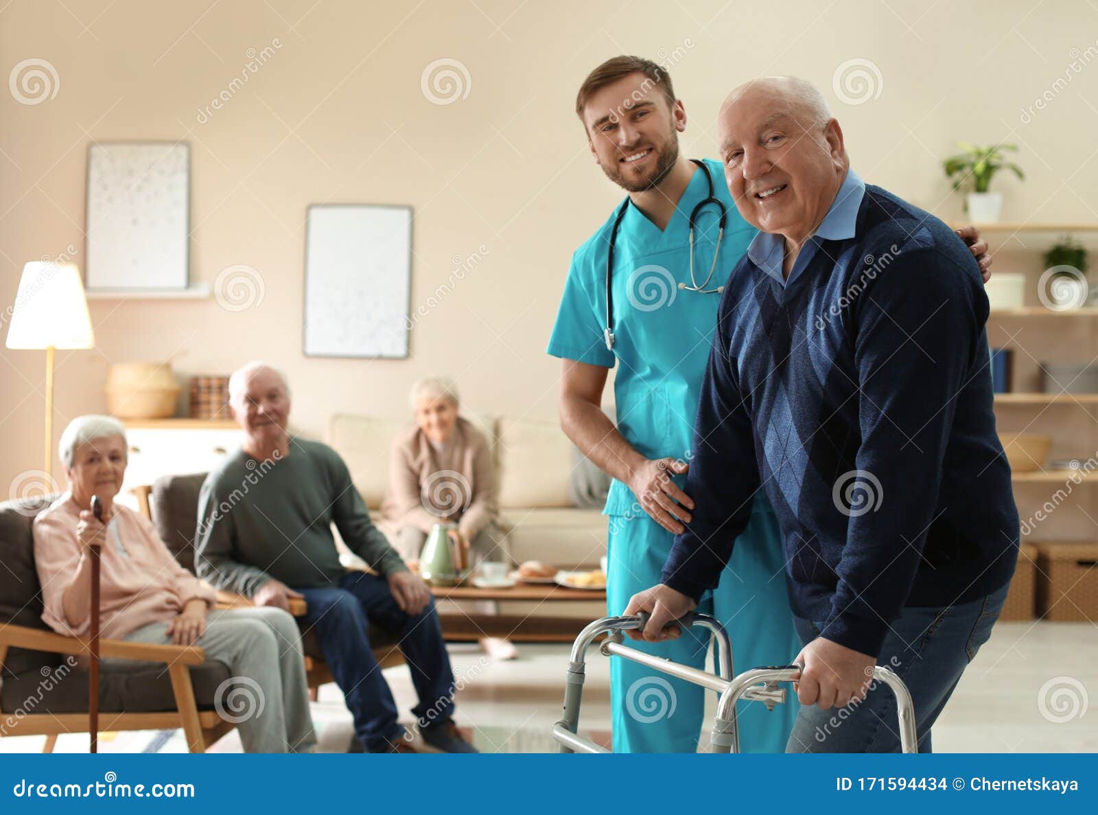 Care Worker Helping To Elderly Man with Walker in Hospice Stock Photo ...