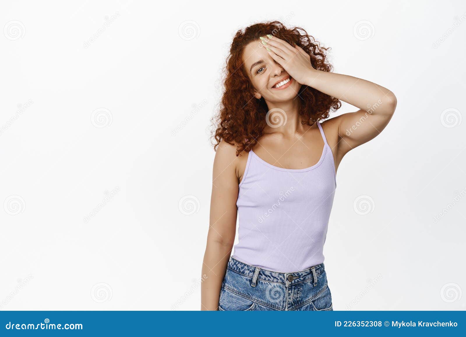 Carefree Curly Haired Girl With Red Hair Laughing And Smiling Happily