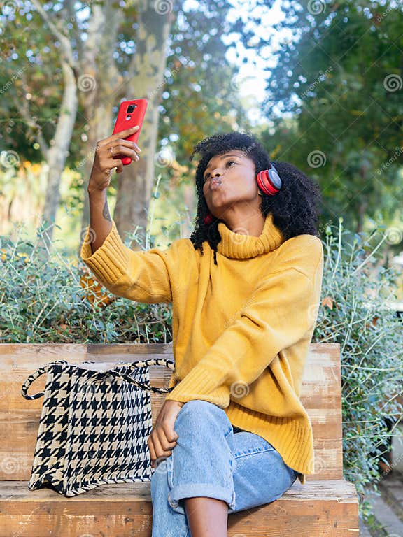 Carefree Young African American Woman Taking A Selfie With A Smartphone