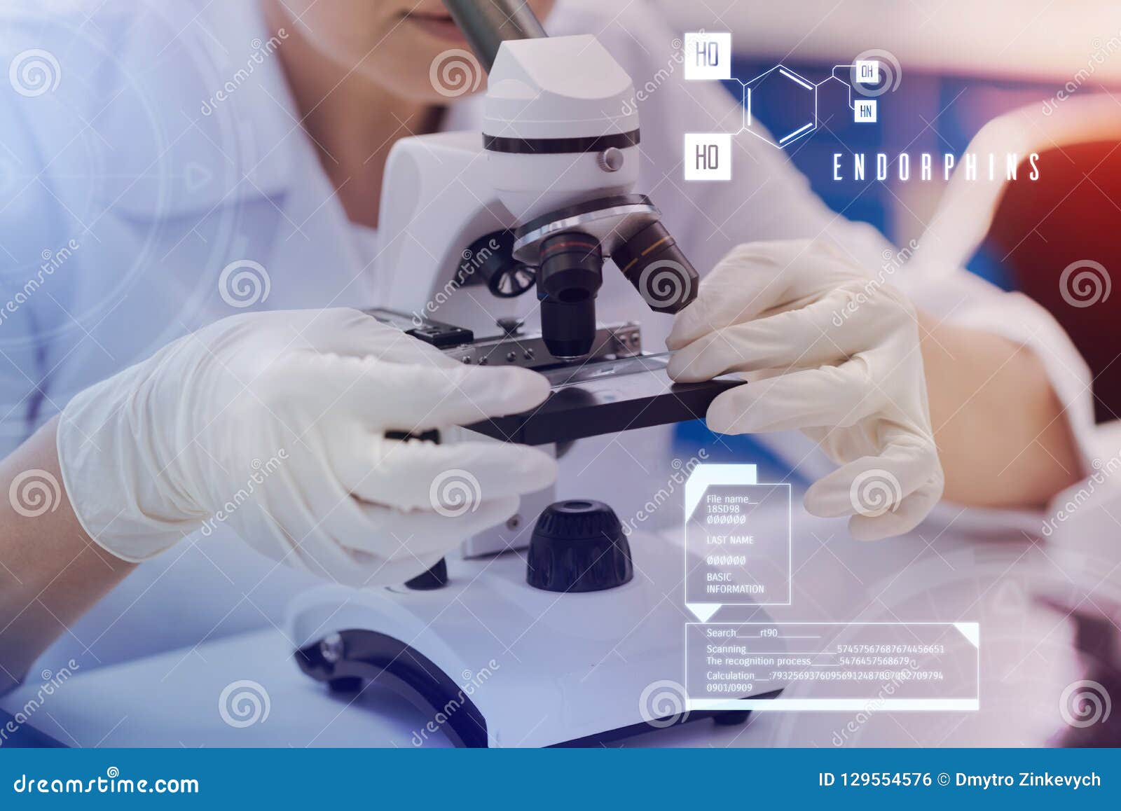 Careful Scientist Holding a Microscope Slide and Looking at it Stock ...