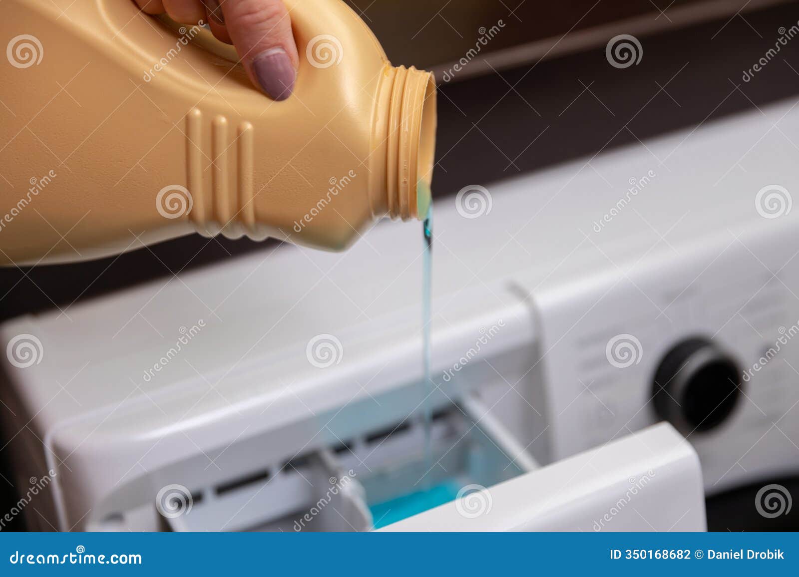 Carefully Pouring the Detergent into the Washing Machine is Essential ...