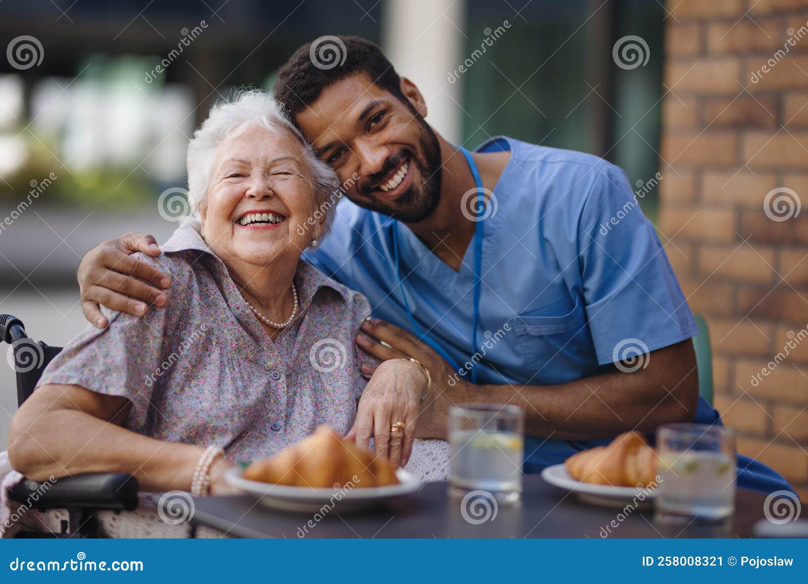 Caregiver Having Breakfast with His Client at Cafe. Stock Image - Image ...