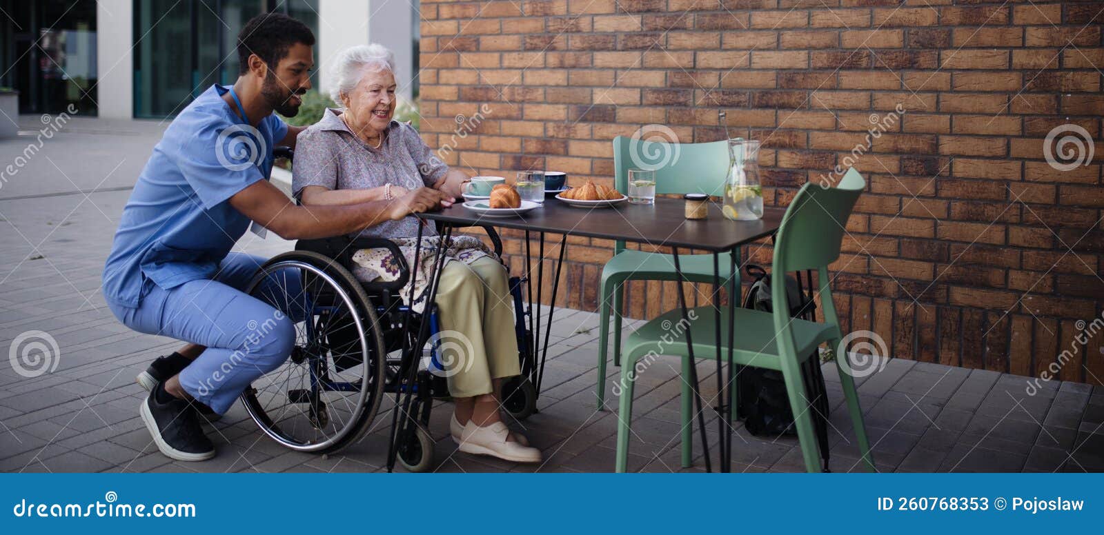 Caregiver Having Breakfast with His Client at Cafe. Stock Image - Image ...