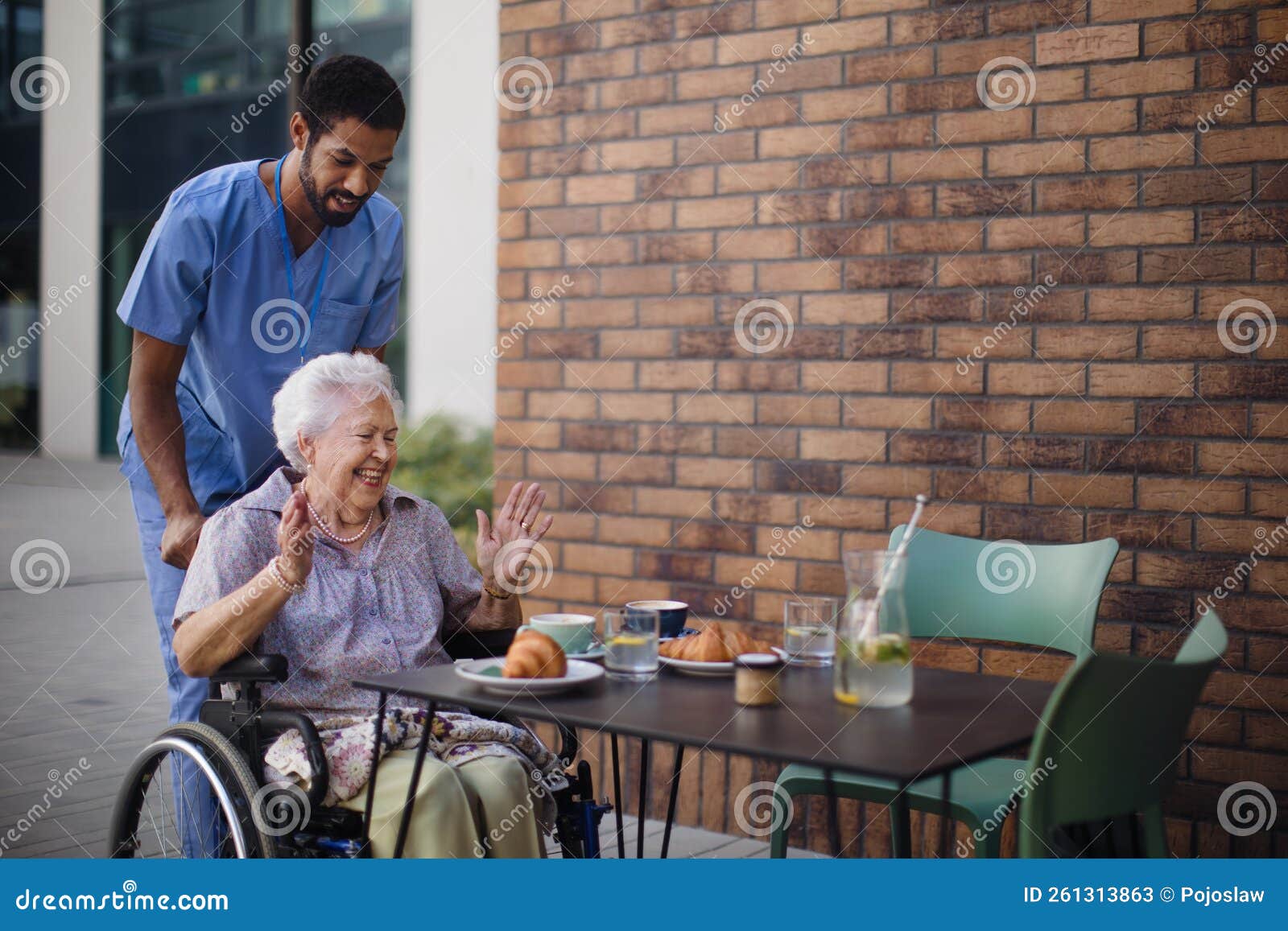 Caregiver Having Breakfast with His Client at Cafe. Stock Image - Image ...