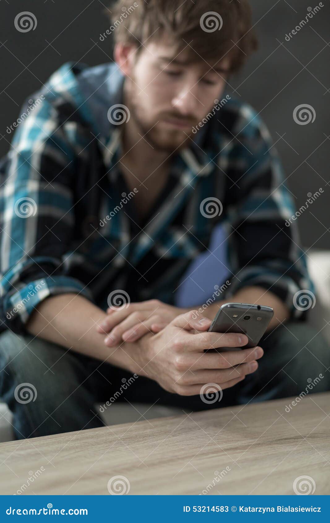 Careless man holding phone stock image. Image of sadness - 53214583