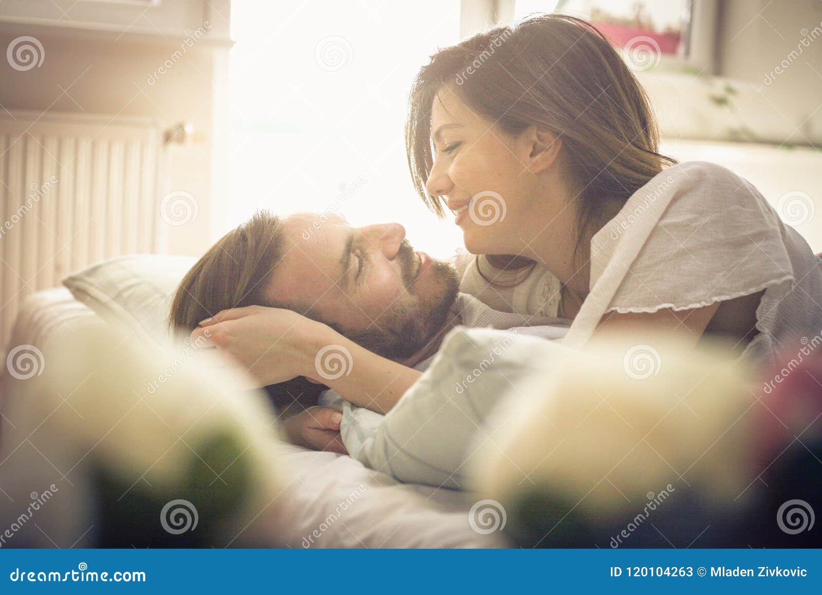 Caressing in bed. stock image. Image of husband, emotion - 120104263