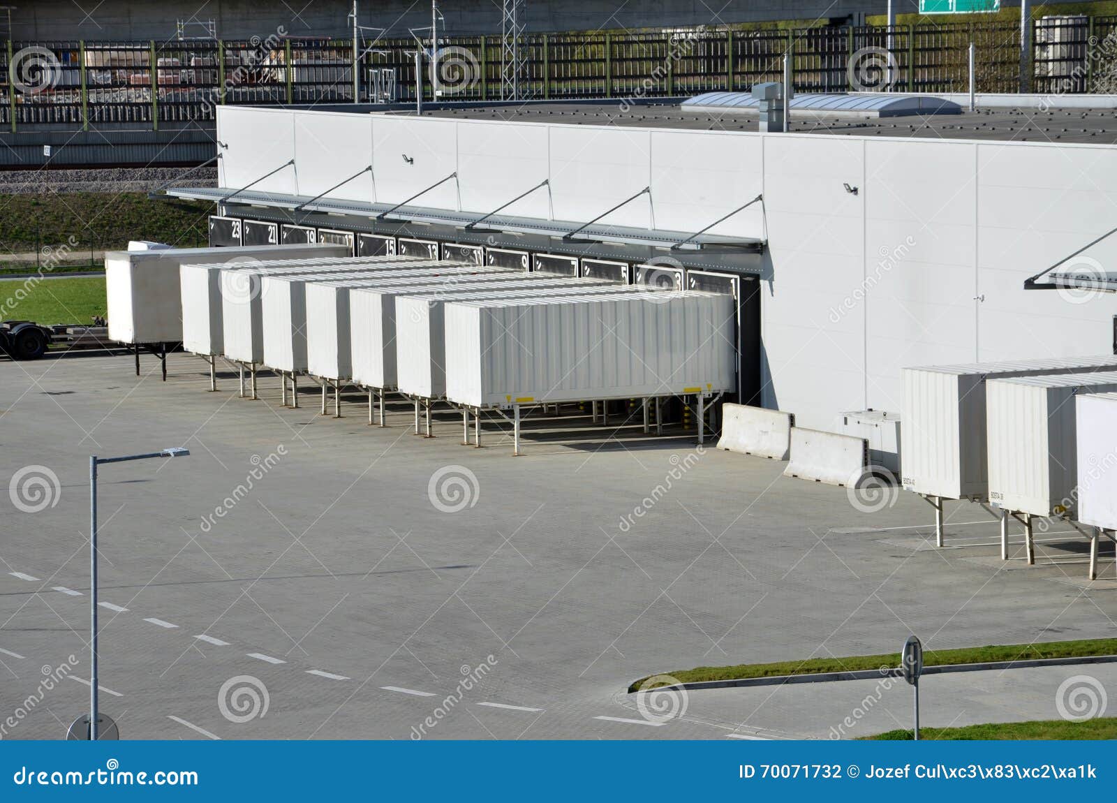 Cargo Containers Standing on Gates in Logistics Center Stock Photo ...