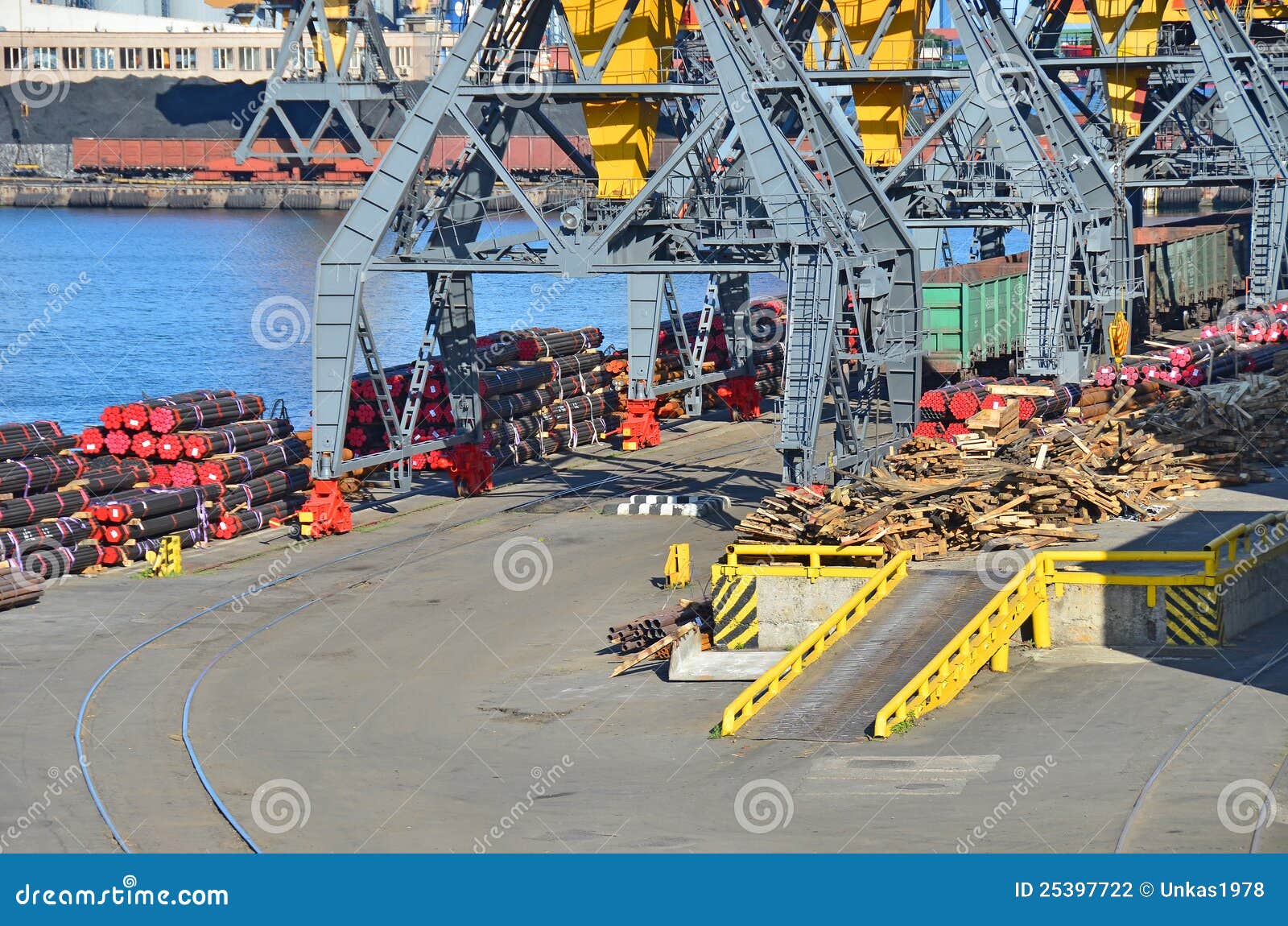 Cargo crane and pipe stack stock photo. Image of quay - 25397722