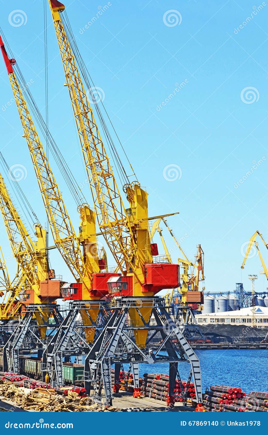 Cargo crane and pipe stack stock photo. Image of mechanism - 67869140