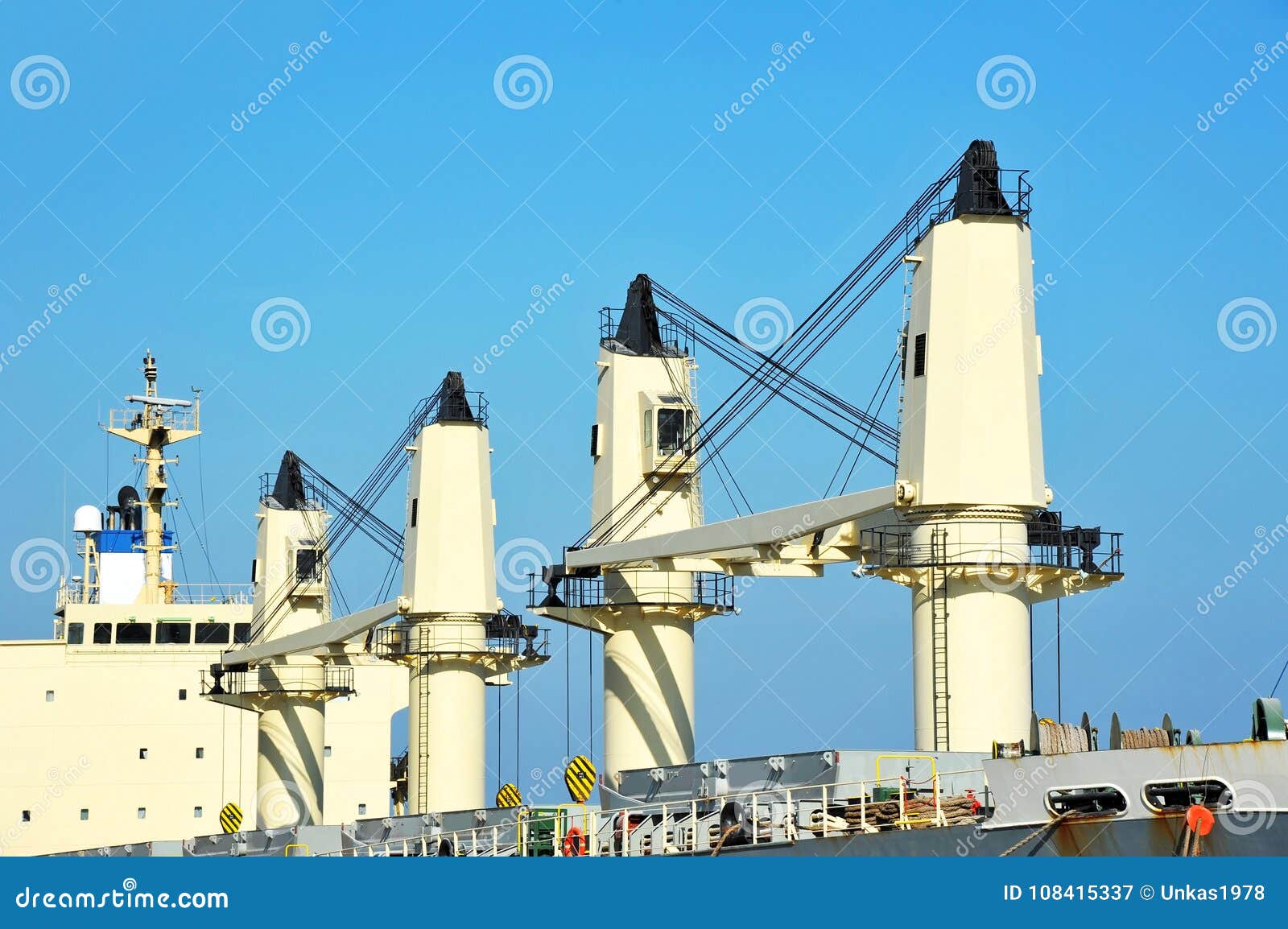 Cargo cranes on bulker stock image. Image of clamshell - 108415337