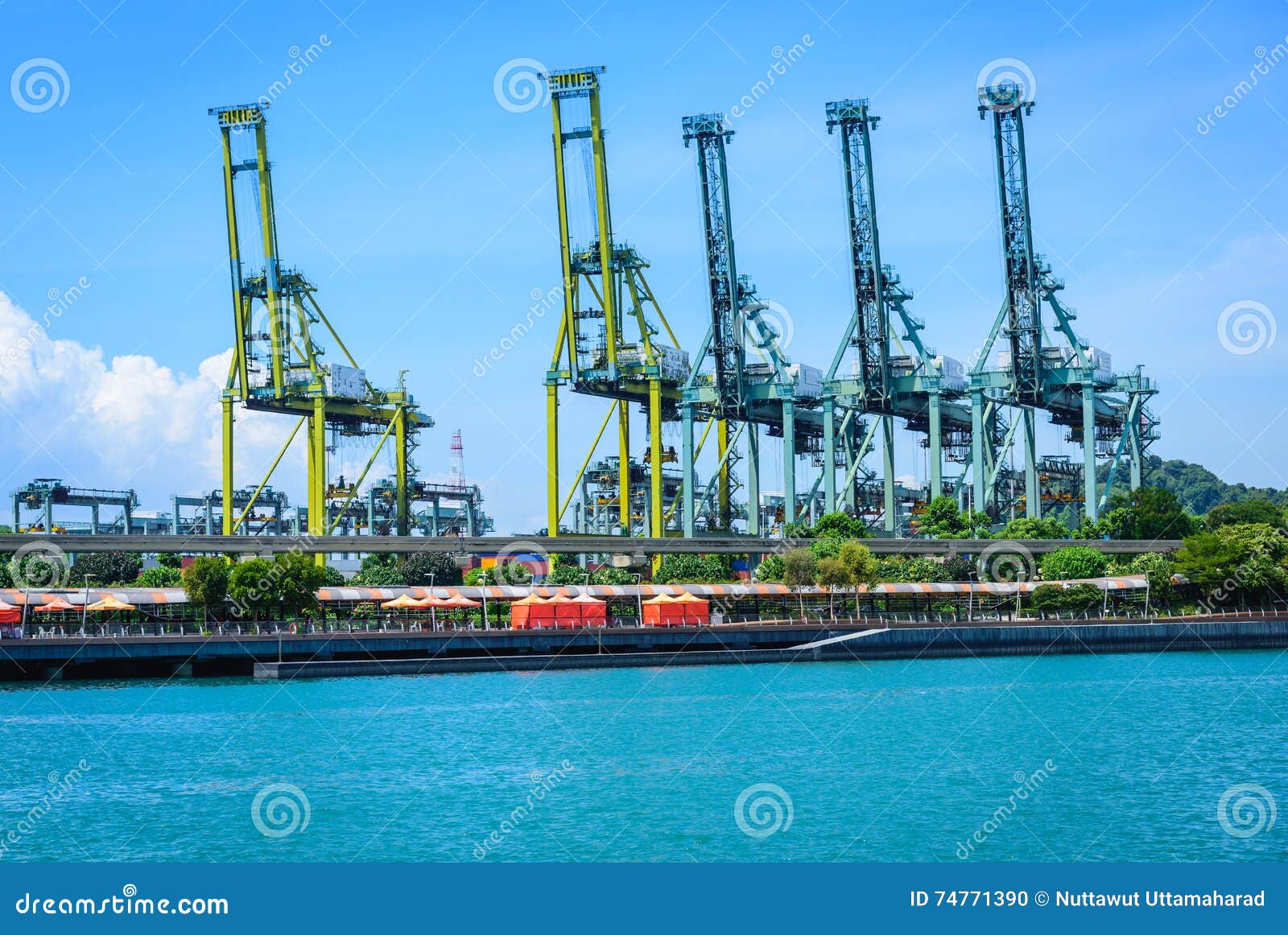 Cargo Cranes in Jetty by the Water Over Blue Sky Stock Photo - Image of ...