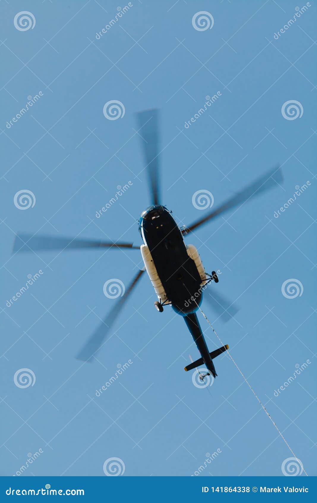 Cargo Helicopter with Suspended Freight on Cable - in Action Stock ...