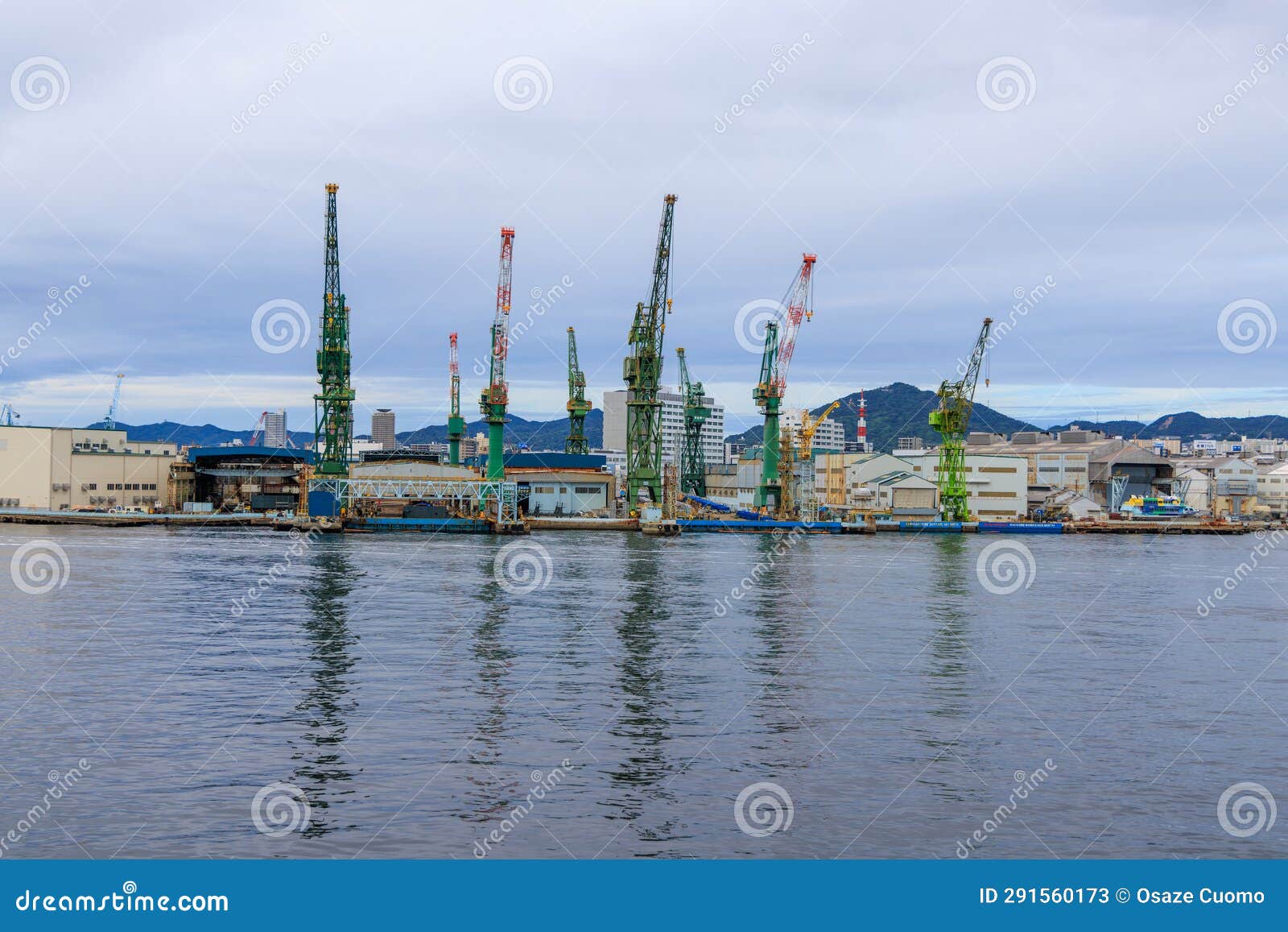 Cargo Loading Cranes Tower Over Empty Dock in Industrial Harbor ... Cargo Loading Cranes Tower Over Empty Dock in Industrial Harbor ...
