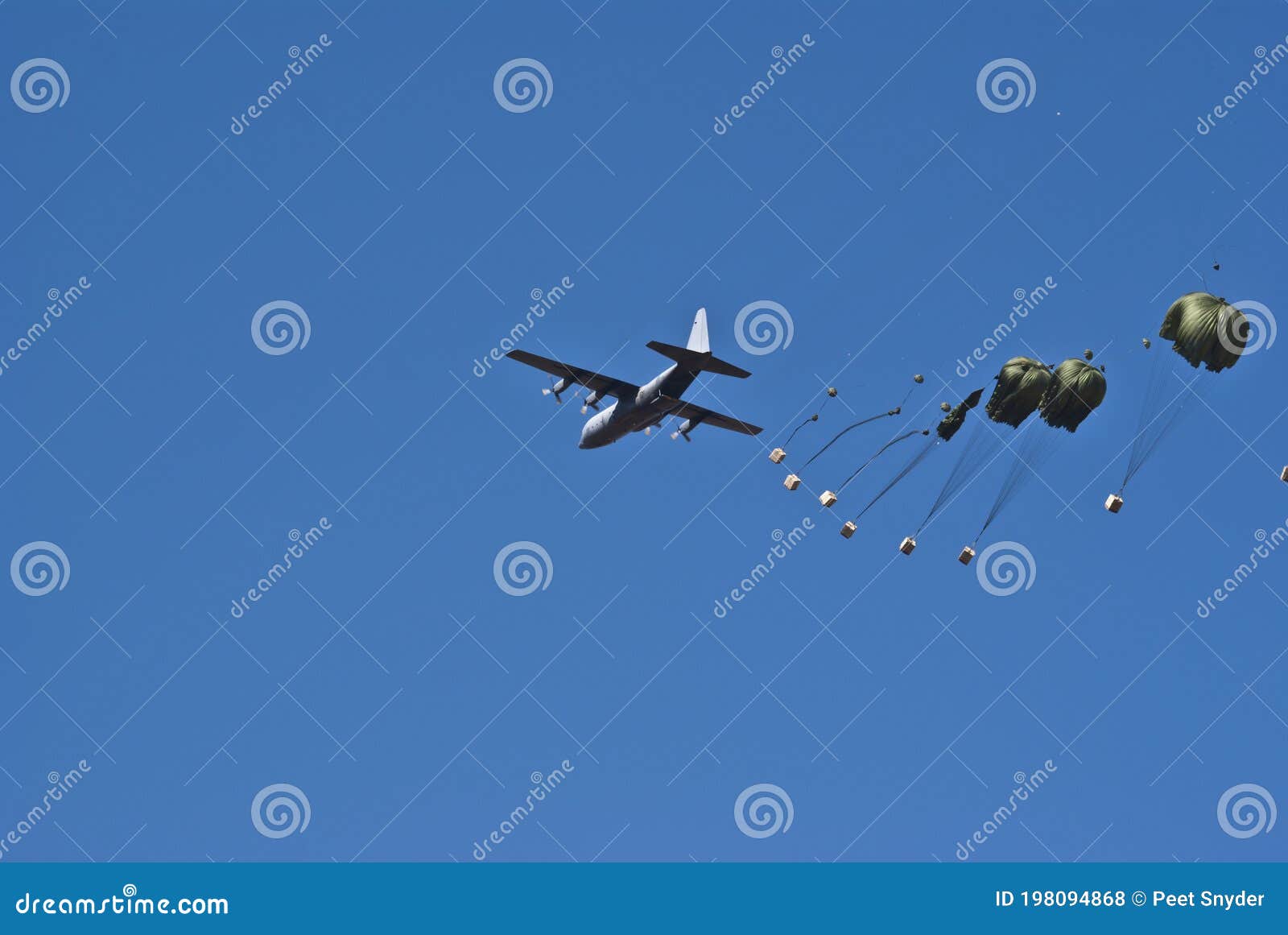 Cargo Plane Dropping Supplies Stock Photo - Image of aircraft, airshow ...